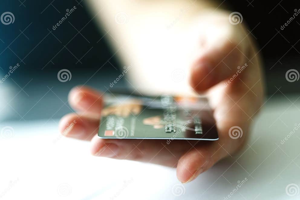 Hand Paying with Credit Card Stock Image - Image of brown, credit: 6736953