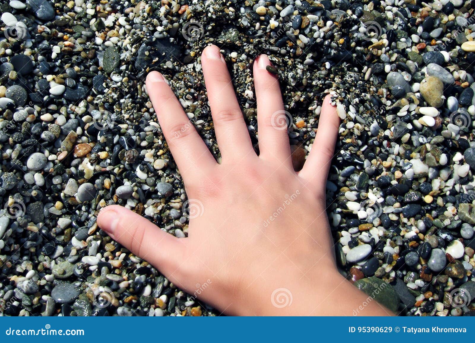 Hand is on pebbles stock image. Image of fingers, beach - 95390629