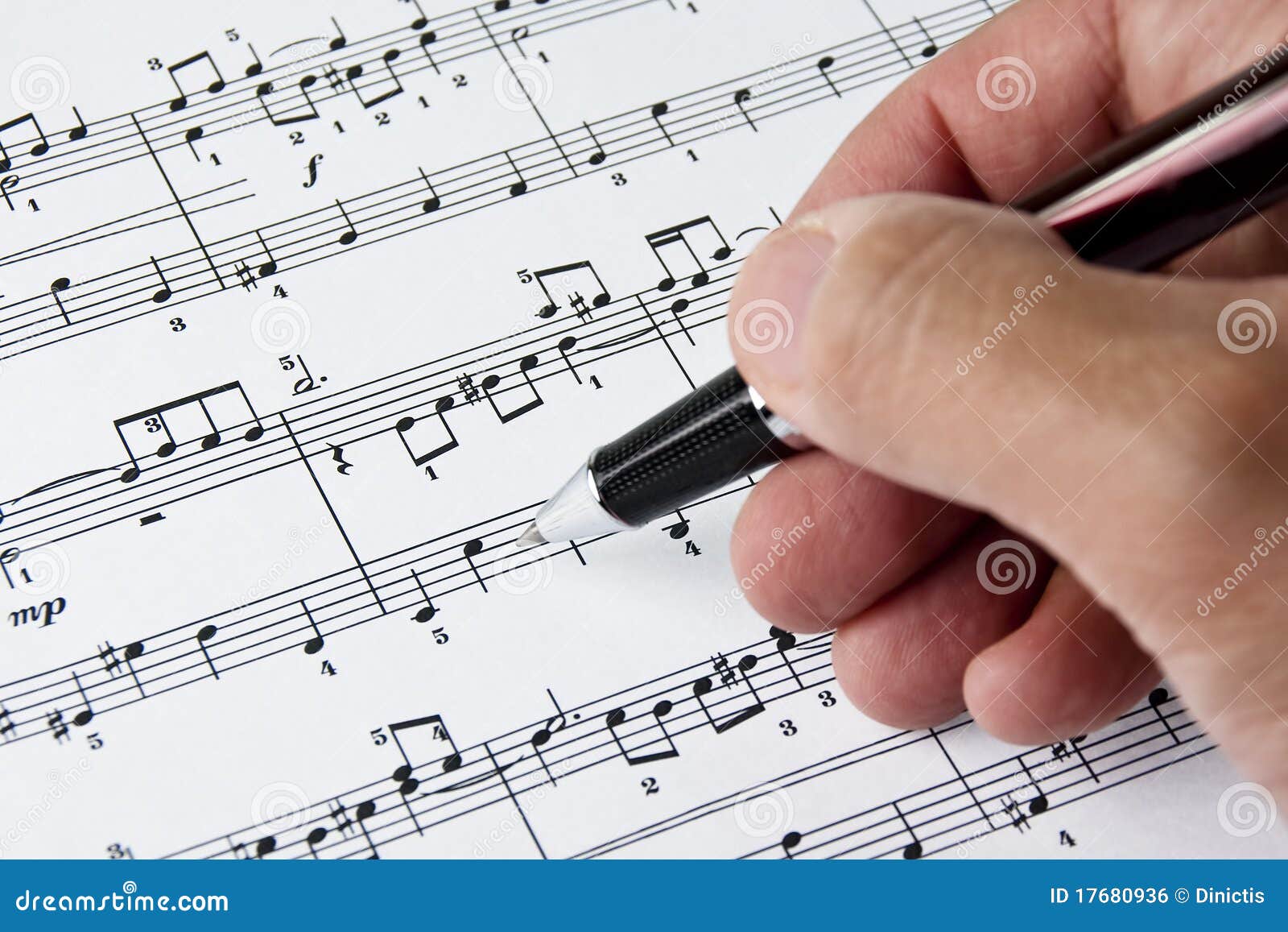A Hand with Pen Checking Musical Notes Stock Photo - Image of button ...