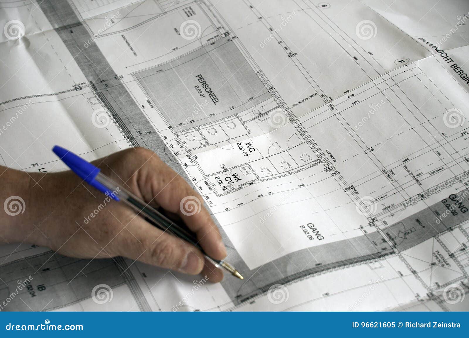 Hand with Pen on Construction Plans Editorial Image - Image of ...
