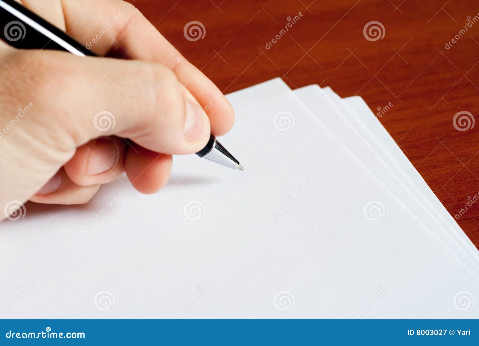 Hand with pen on the paper stock image. Image of detail - 8003027