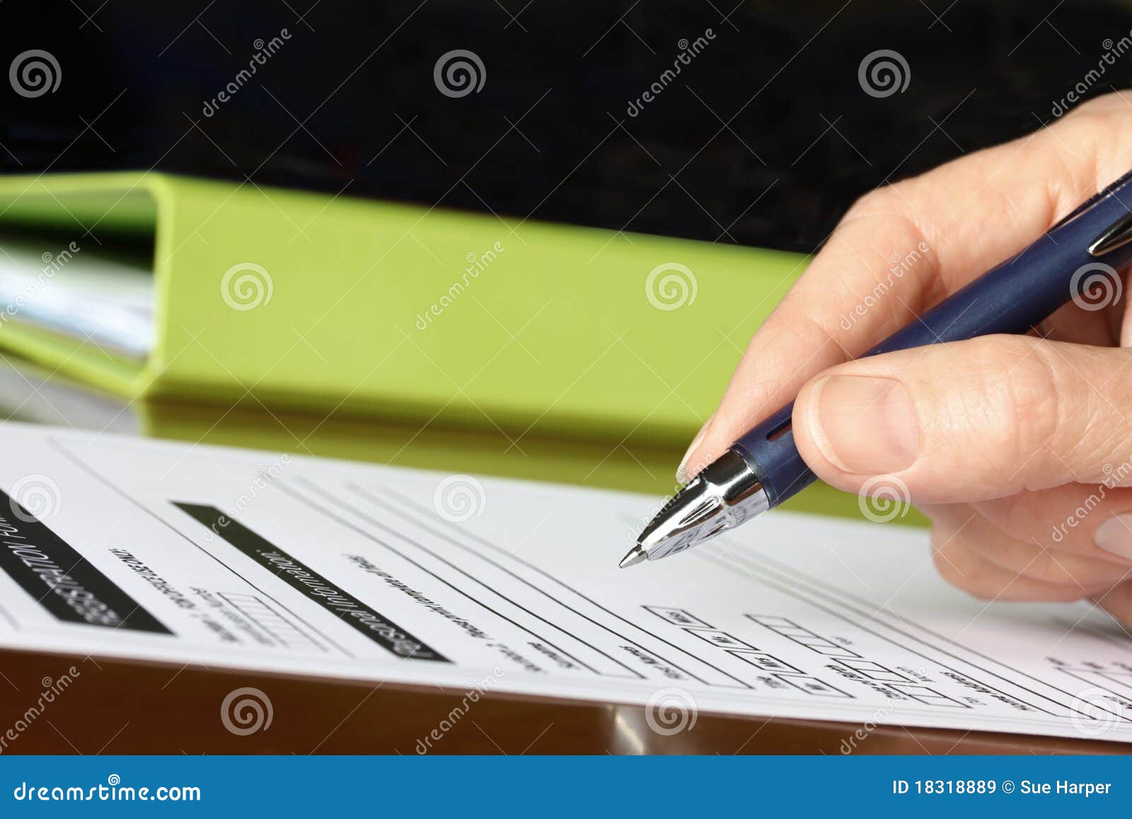 Hand with Pen Signing Form by Green Folder Stock Image - Image of ...
