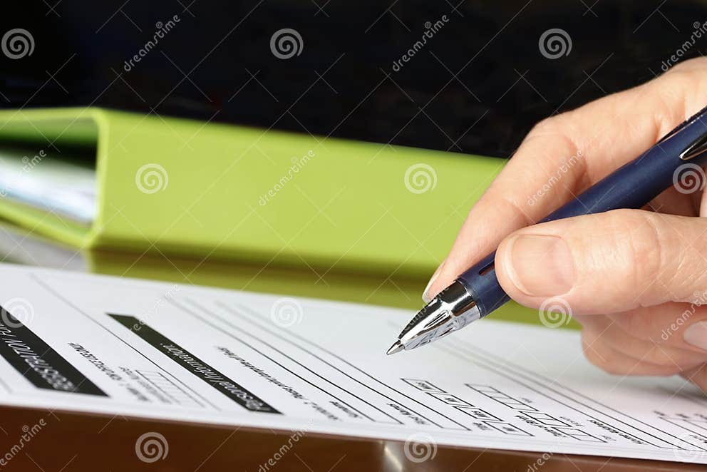 Hand with Pen Signing Form by Green Folder Stock Image - Image of ...