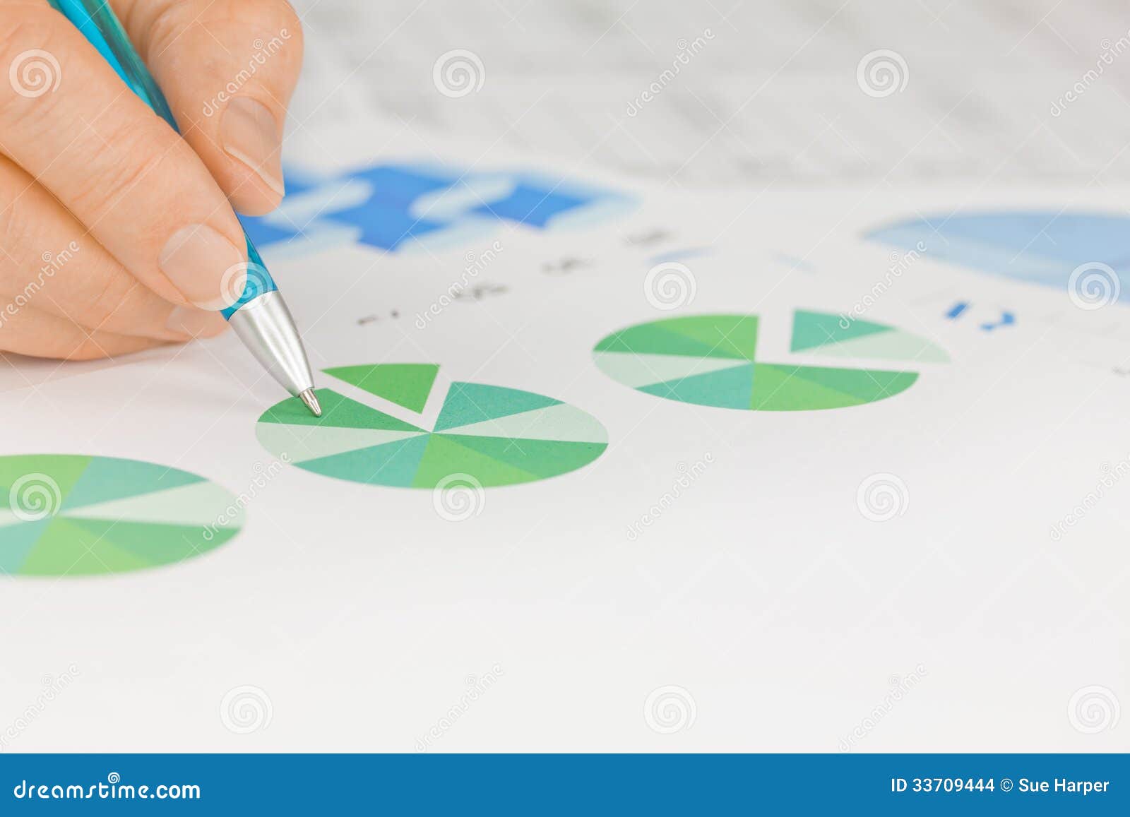 Hand with Pen Working on Graphs and Pie Chart Stock Photo - Image of ...