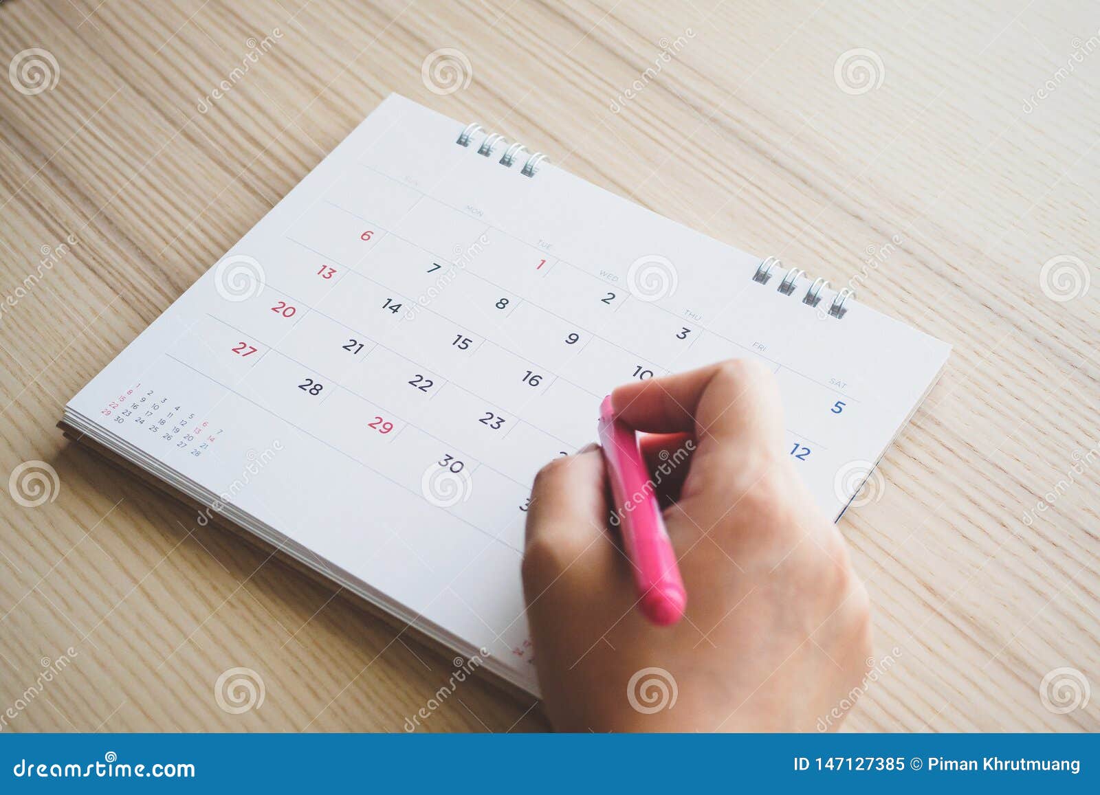 Hand with Pen Writing on Calendar Page Closeup Stock Image - Image of ...