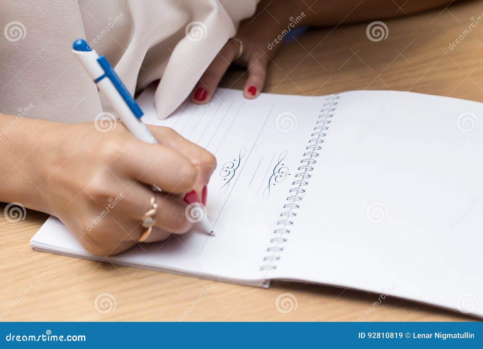 Hand with Pencil Writing in Notebook on Wooden Table Stock Image ...