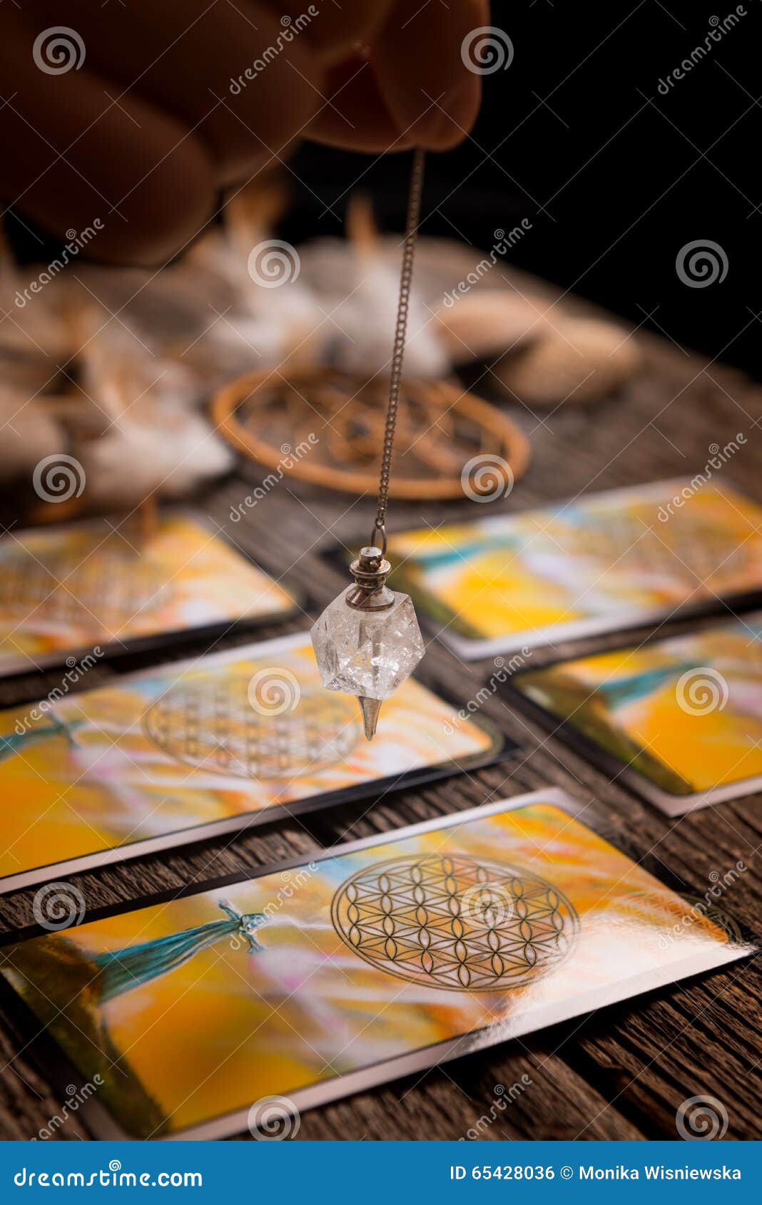 Hand with Pendulum Over Tarot Cards Stock Photo - Image of spirituality ...