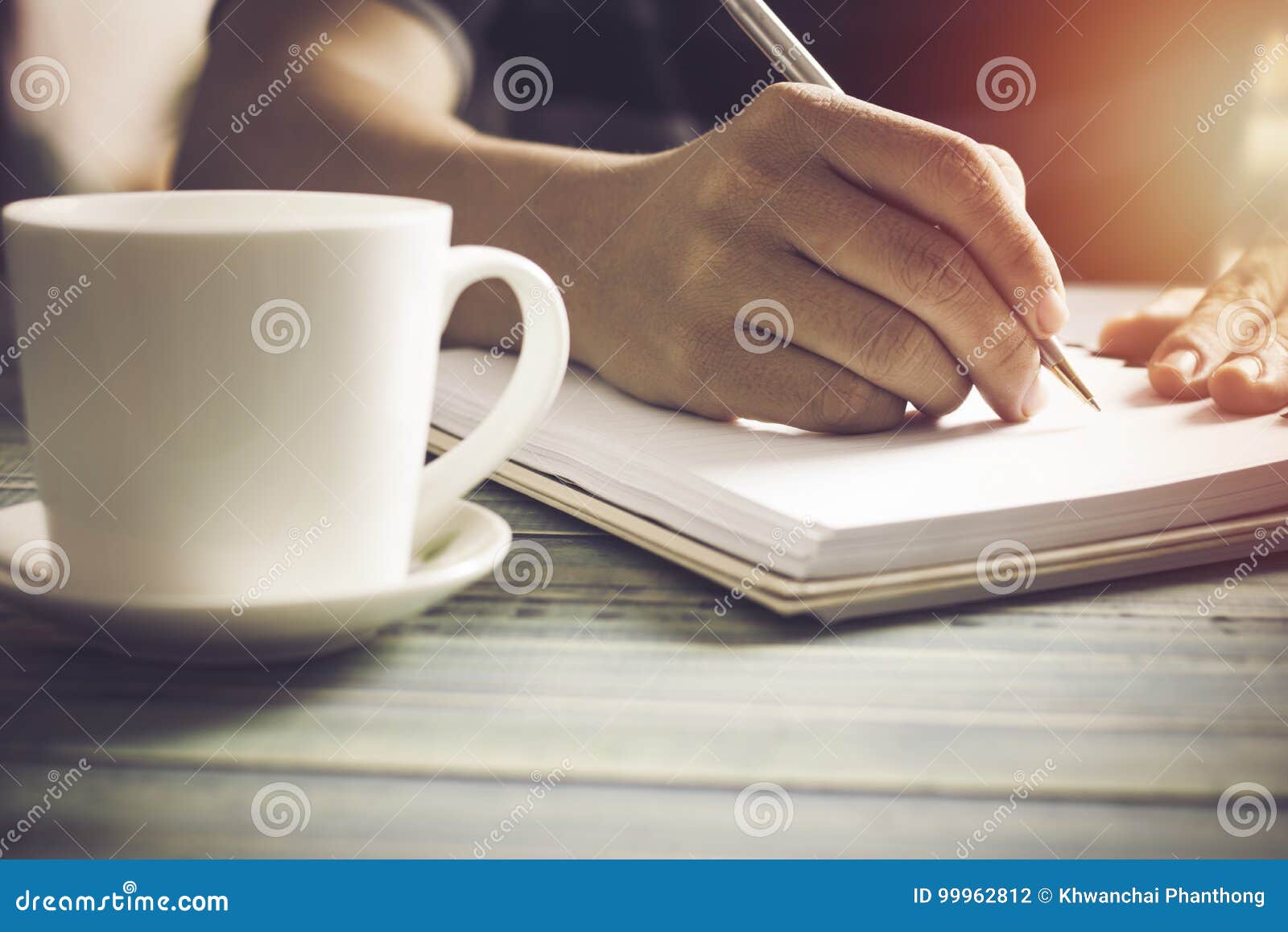 Hand of People, Student Writing and Note on Notebook on Wood Table with ...