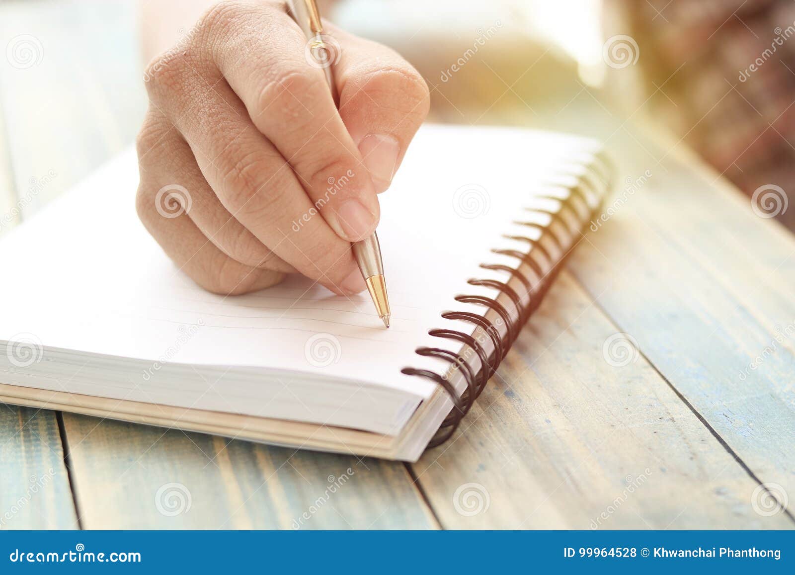 Hand of People, Student Writing and Note on Notebook on Wood Table with ...