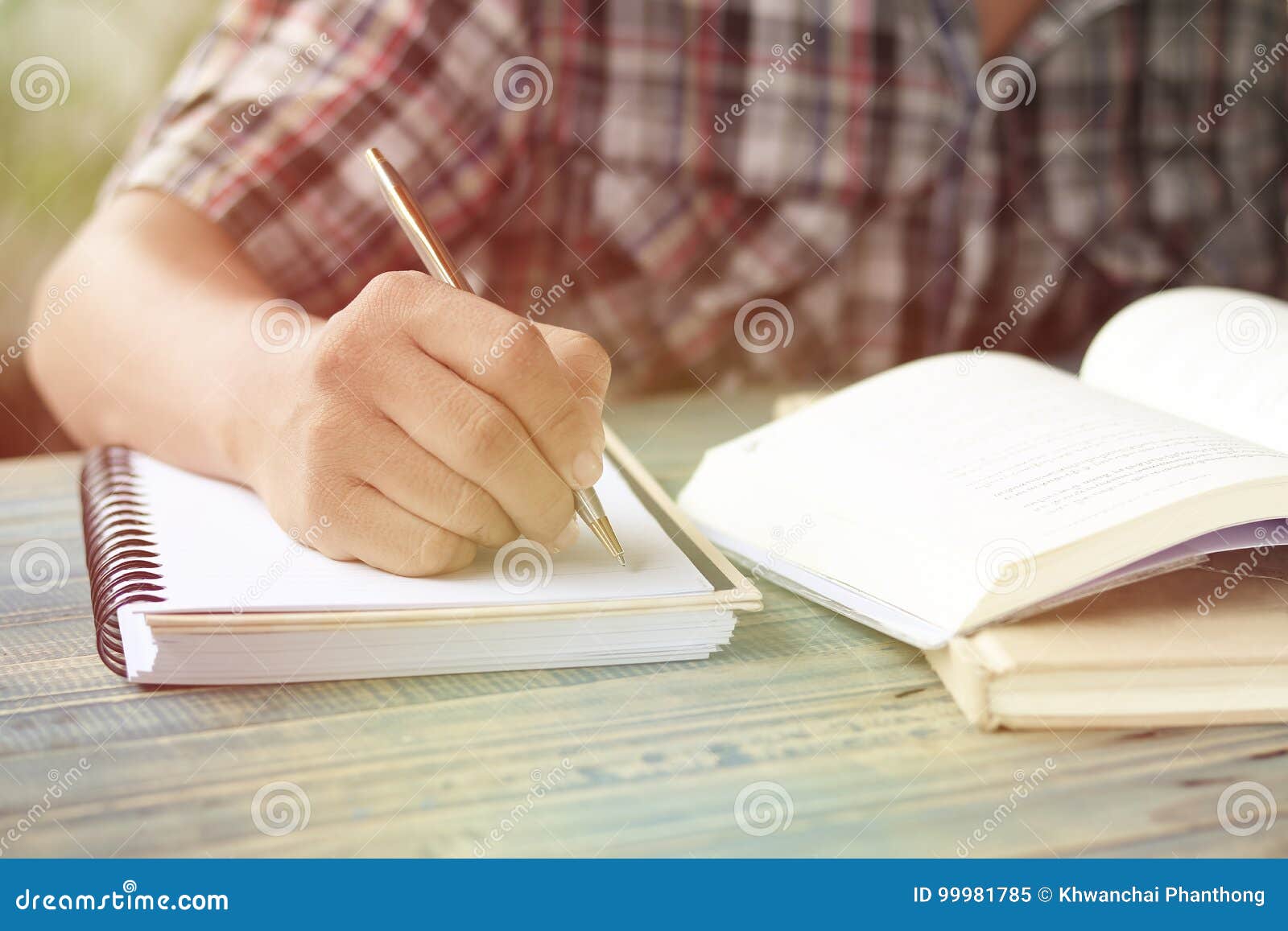 Hand of People, Student Writing and Note on Notebook on Wood Table with ...
