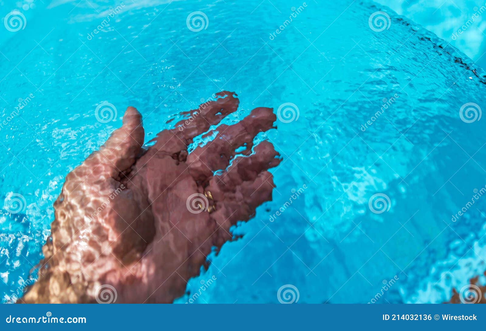 Hand of a Person in the Crystal Blue Water of a Pool Stock Photo ...