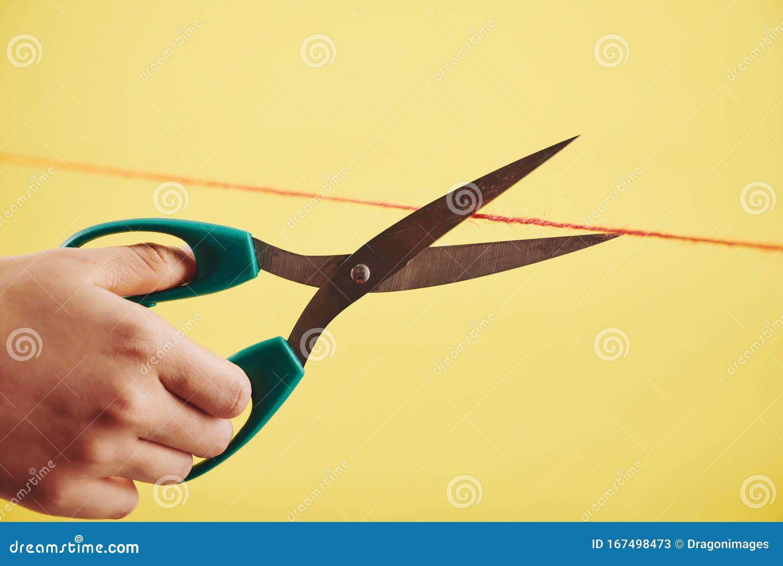 Person cutting red thread stock image. Image of females - 167498473
