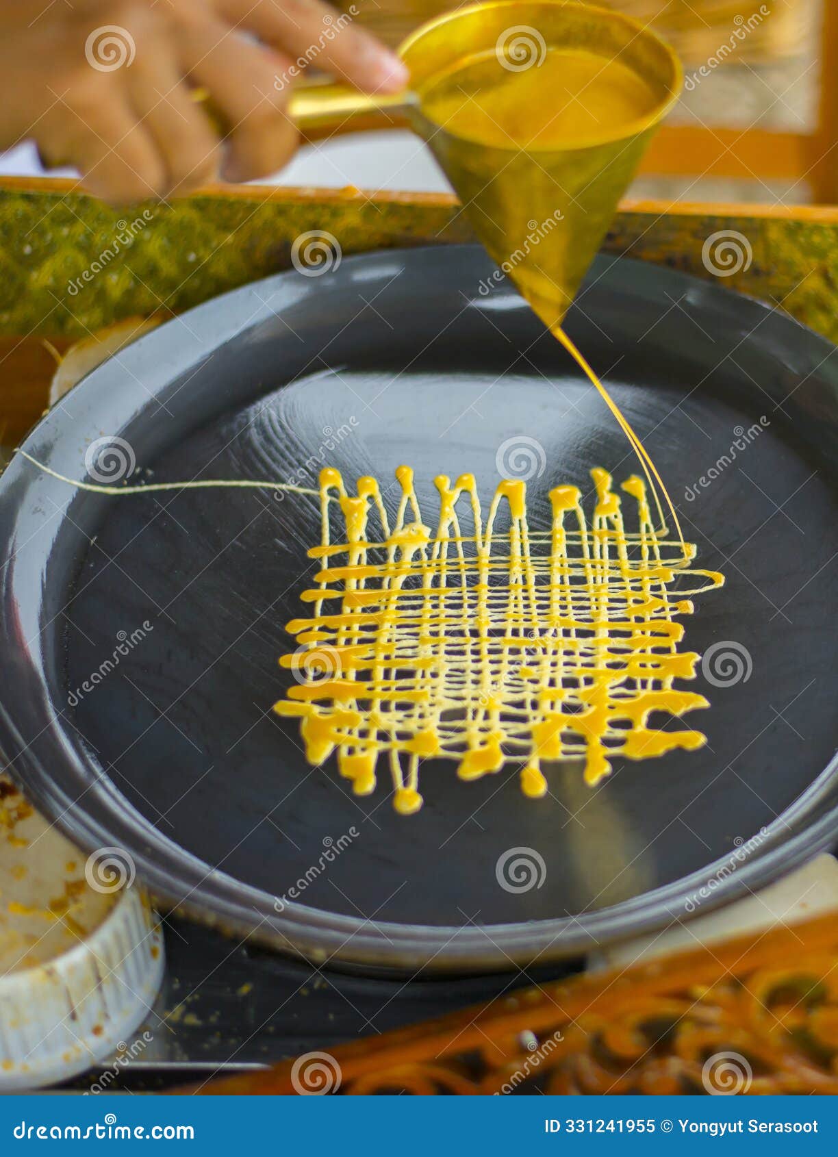 The Hand of the Person Who is Cooking with the Traditional Asian Stock ...