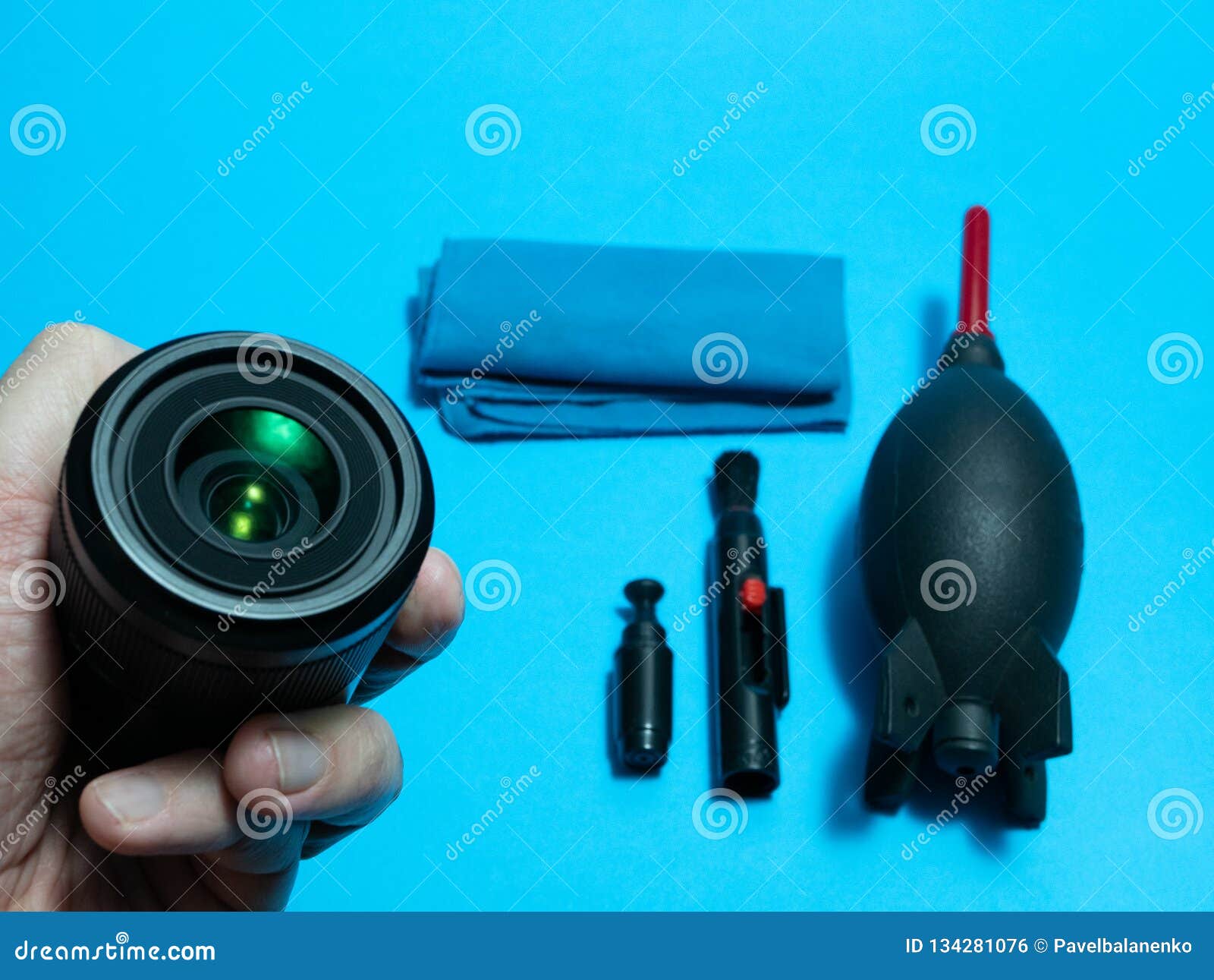 Hand with Photography Lens and Cleaning Tools Stock Photo - Image of ...