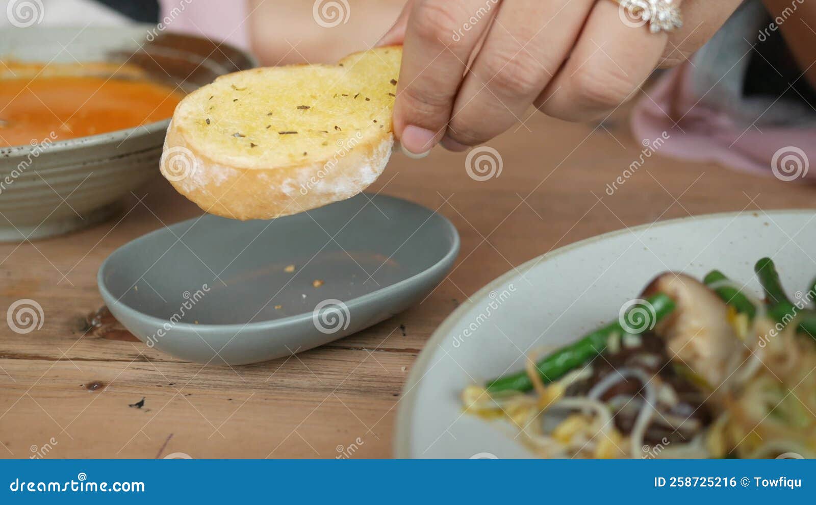 Hand Pick Garlic Bread on a Plate on Table Stock Footage - Video of ...