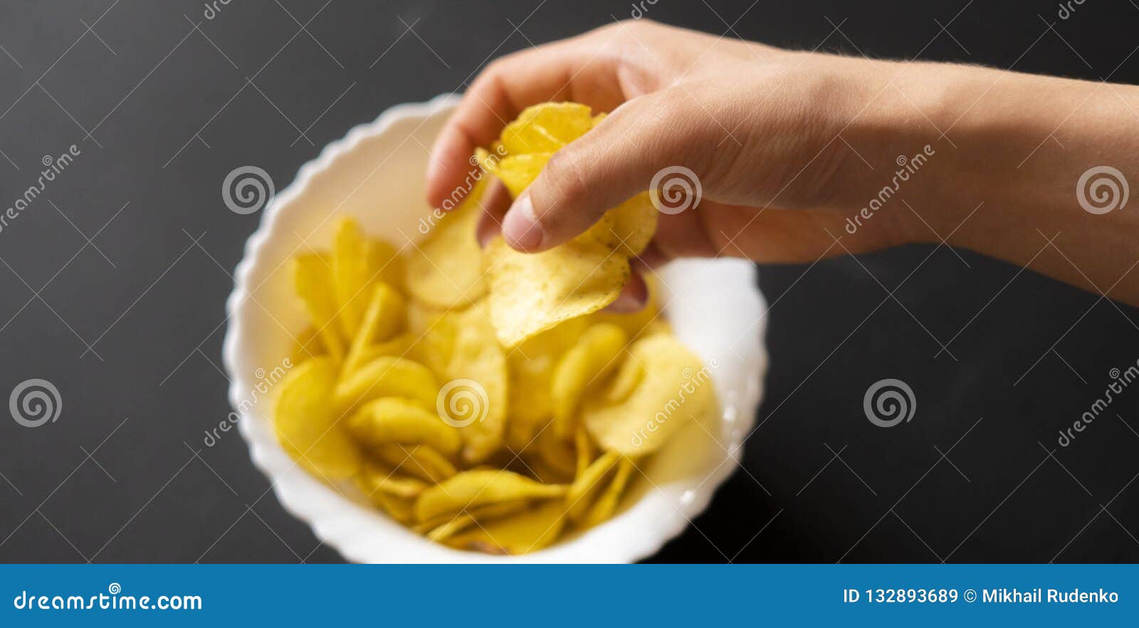 Hand Pick Take the Fried Potato Chips from the Plate F Stock Image ...