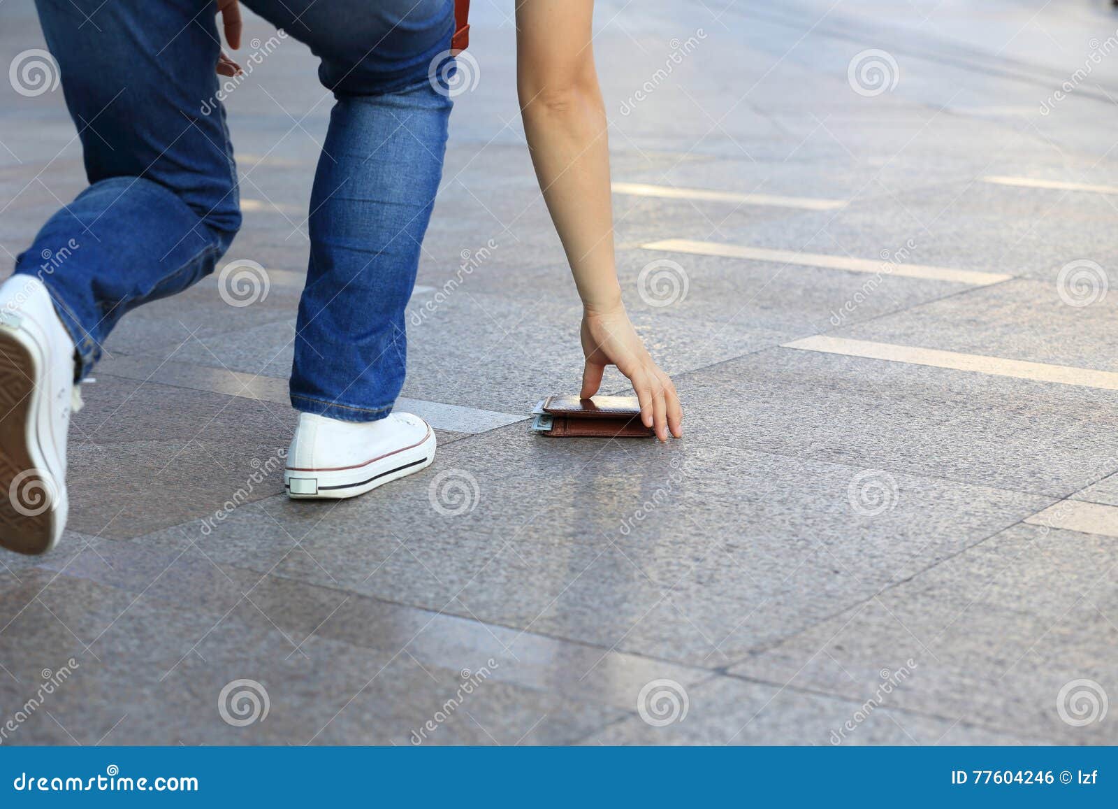 Guy Picking Up A Lost A Lost Purse/wallet Royalty-Free Stock Photo ...