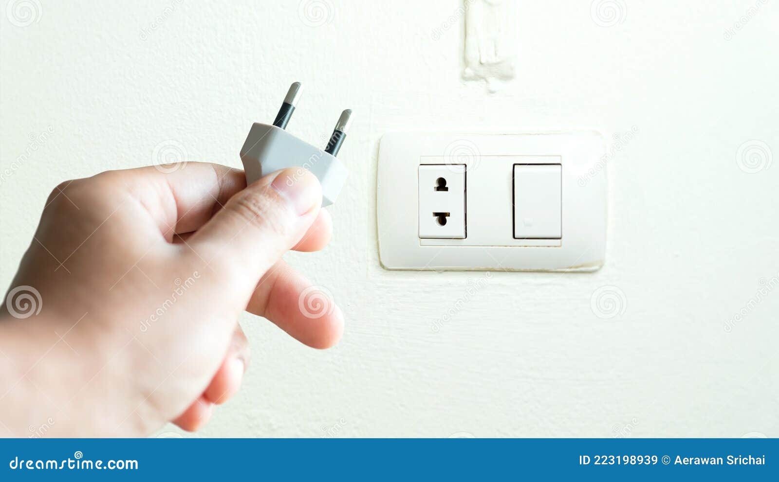 A Hand Pick Up Two Pin Electrical Plug. Stock Image - Image of ...