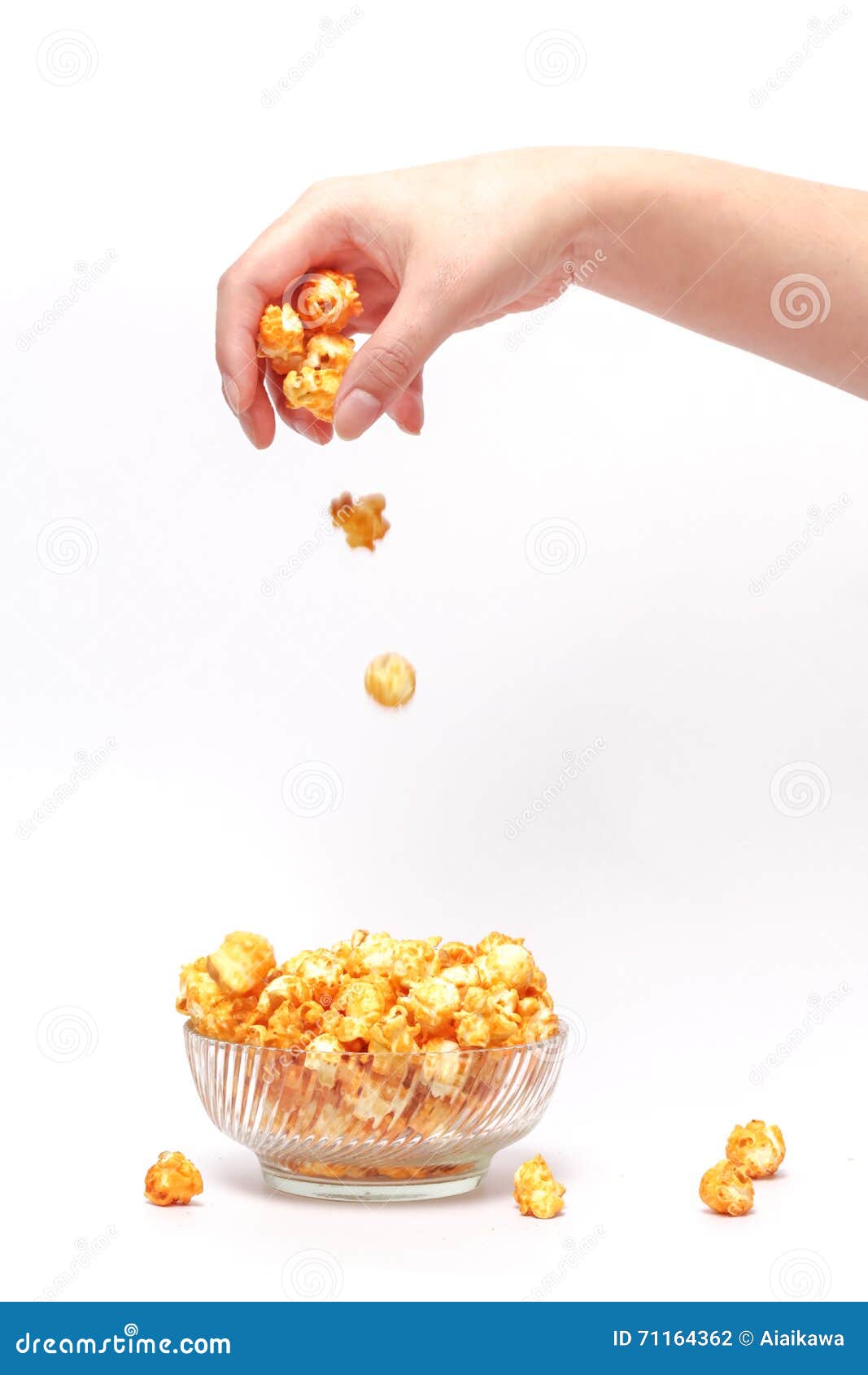 Hand Picking Caramel Popcorn Filled in Crystal Clear Bow Stock Photo ...