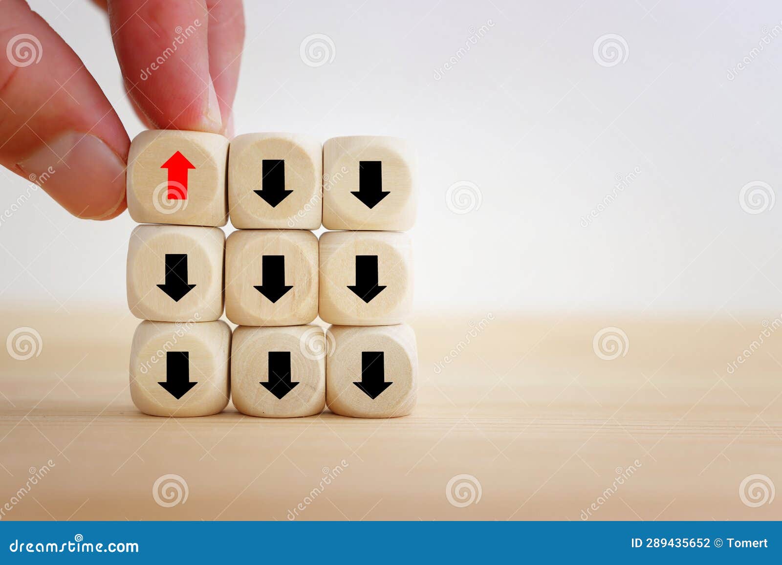 Hand Picking Cube with Red Arrow Facing Up Stock Photo - Image of ...