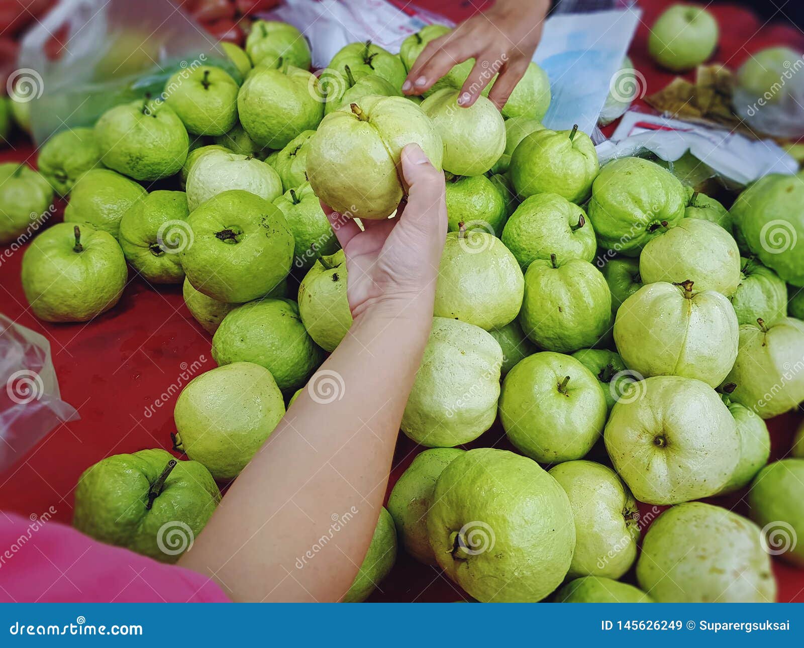 Hand Picking a Fresh Green Guava Fruit at Market Stock Image - Image of ...