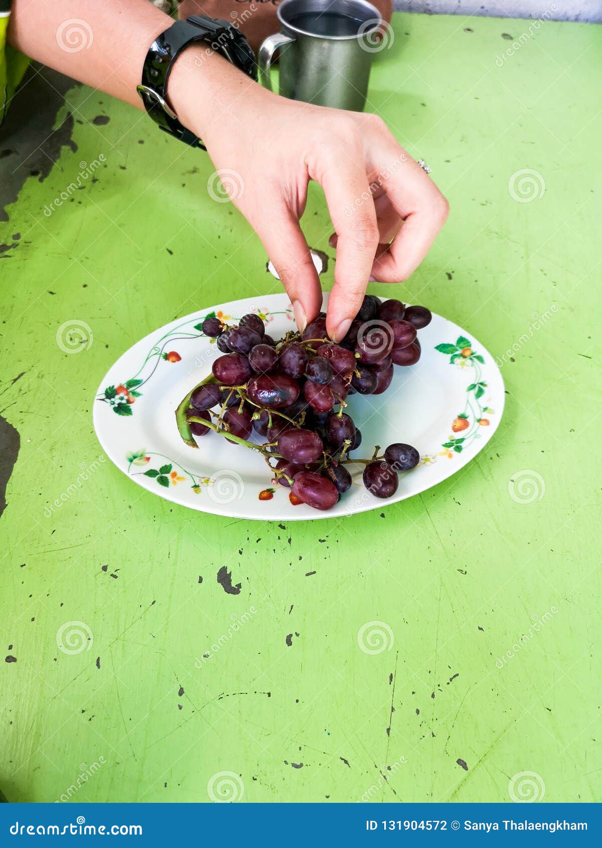 The hand is picking grapes stock photo. Image of white - 131904572
