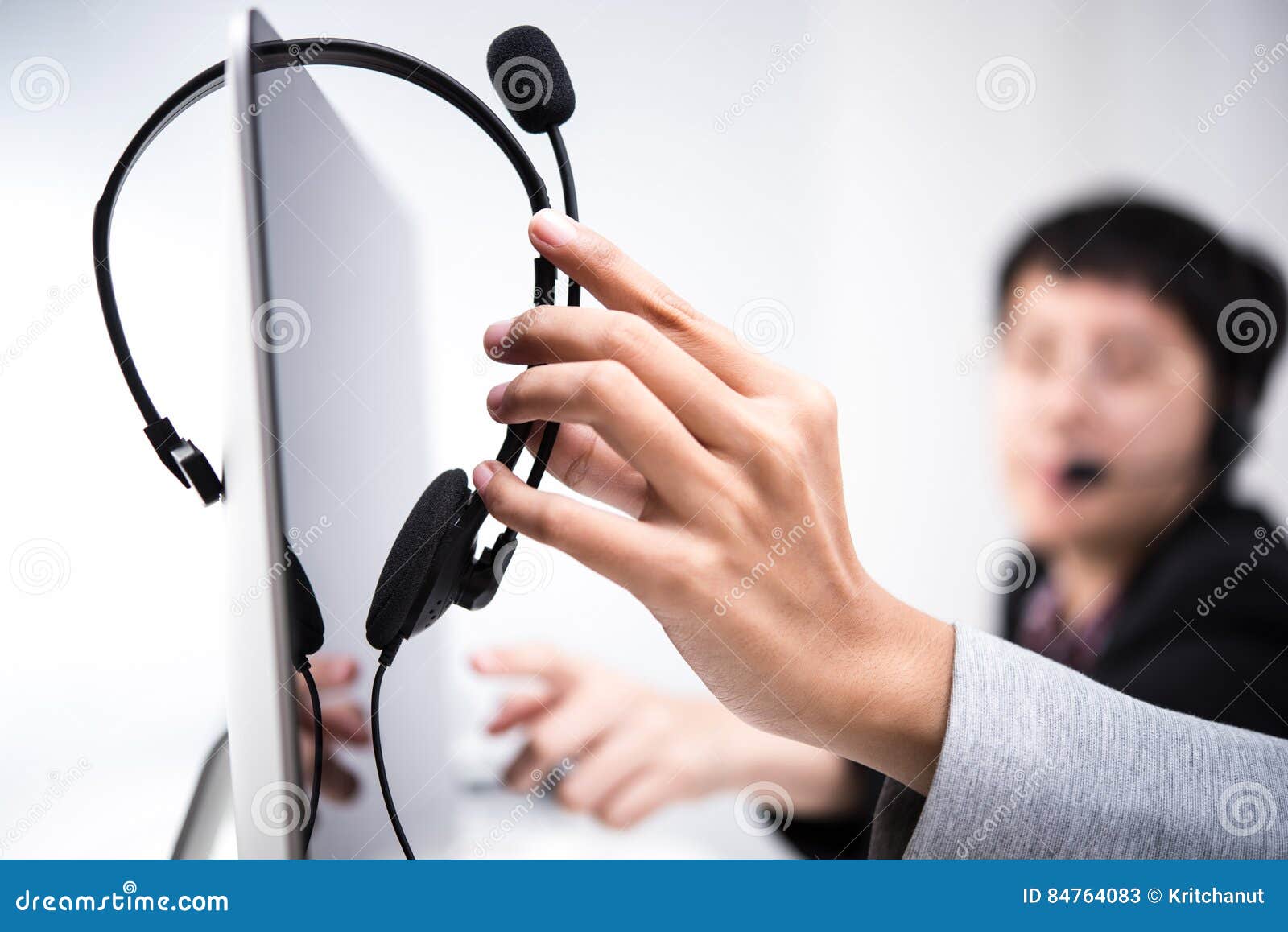 Hand Picking Up Headphone that Hanging on Computer Screen Stock Image ...