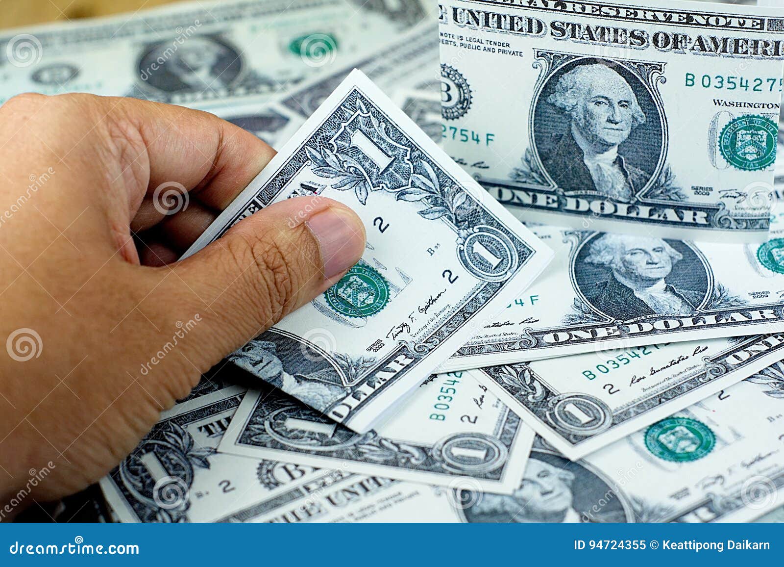 Hand Picking US Dollar Banknote from Stack of Banknotes on the F Stock ...