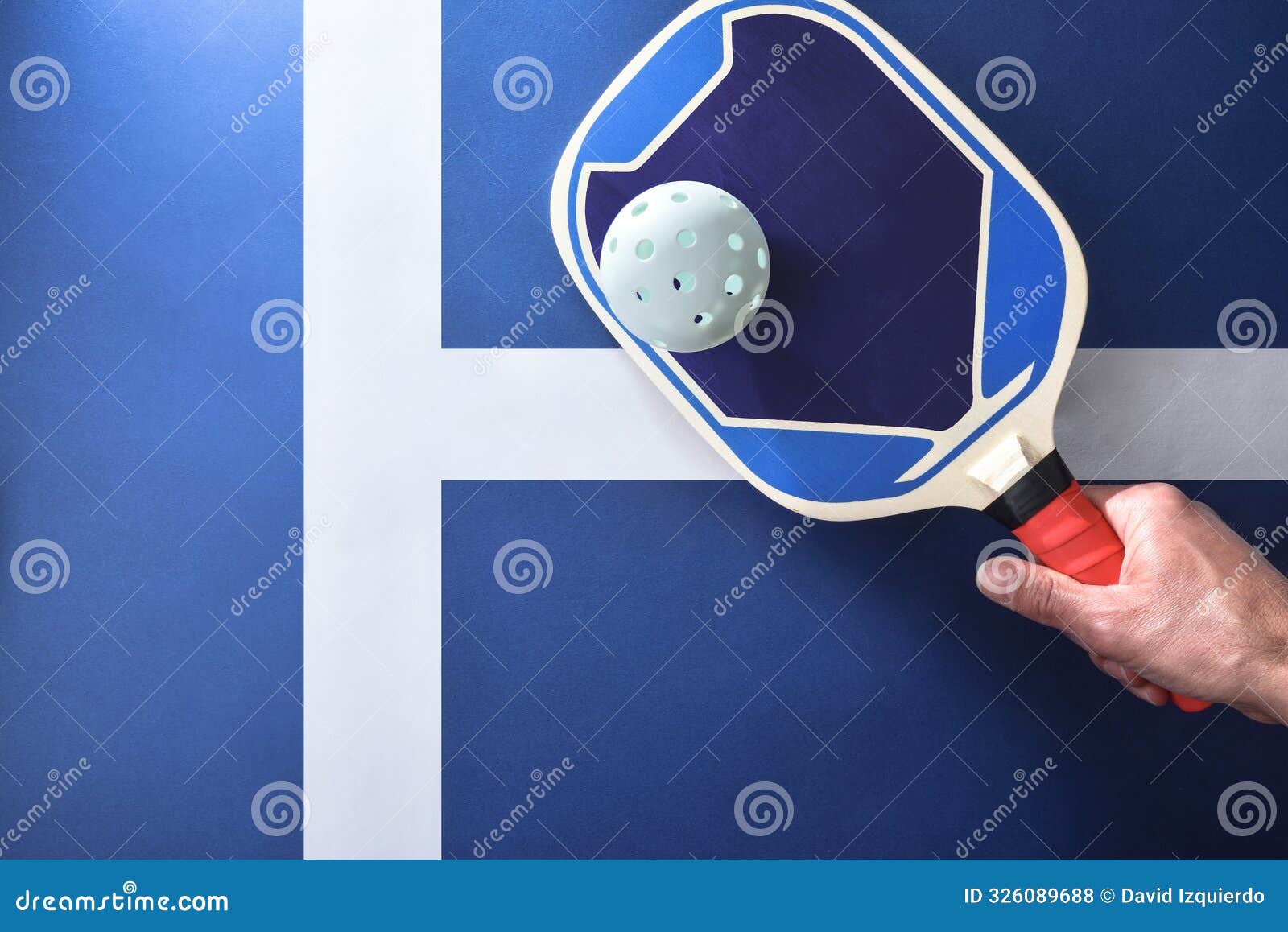 Hand with Pickleball Paddle Hitting a Ball on Playing Surface Stock ...