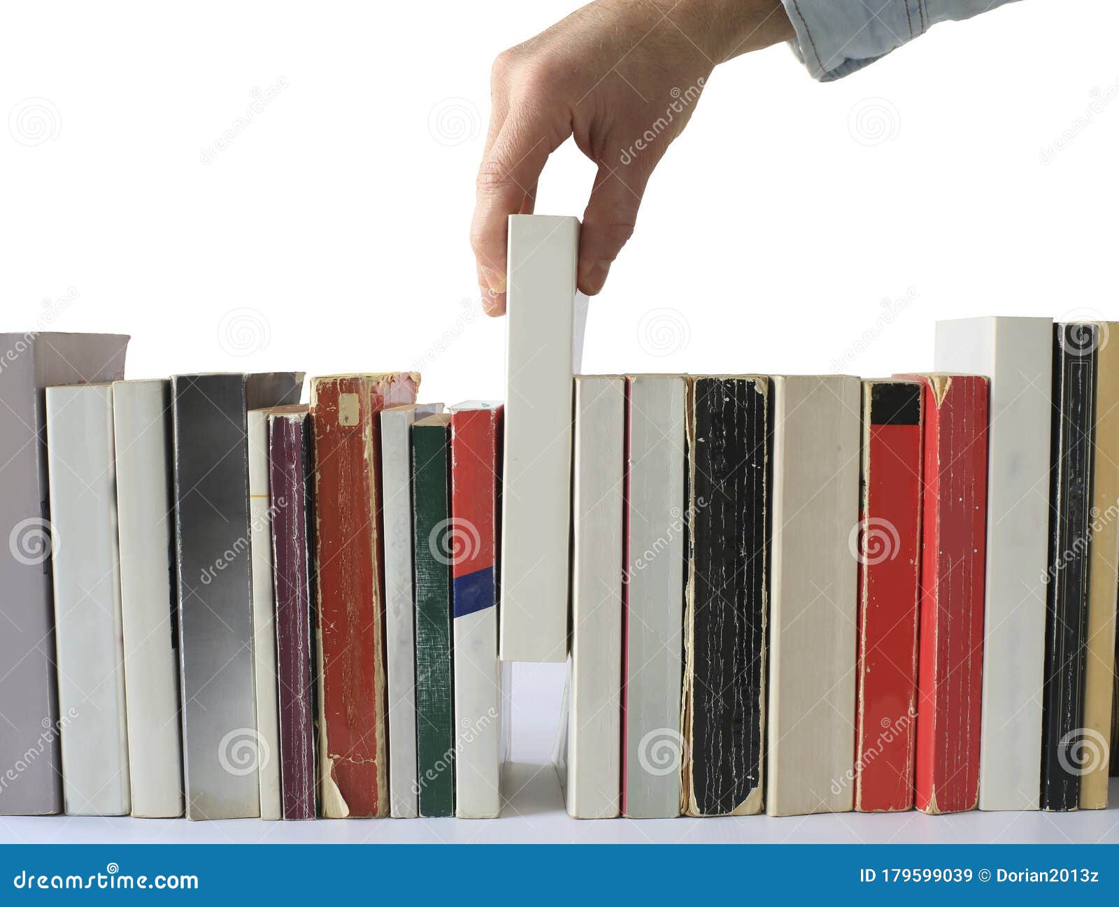 Hand picks up a book stock image. Image of cover, wisdom - 179599039
