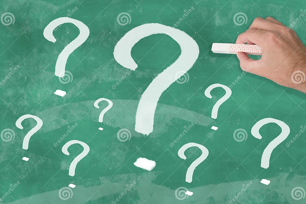 Hand with a Piece of Chalk Drawing Multiple Question Marks on ...