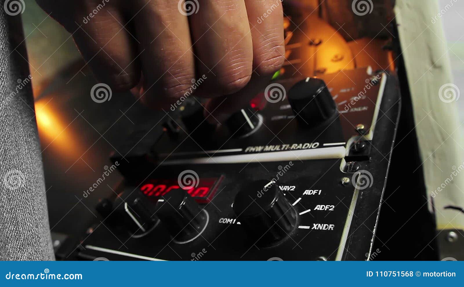 Hand of Pilot Selecting Radio Frequency, Turning Control on Panel ...