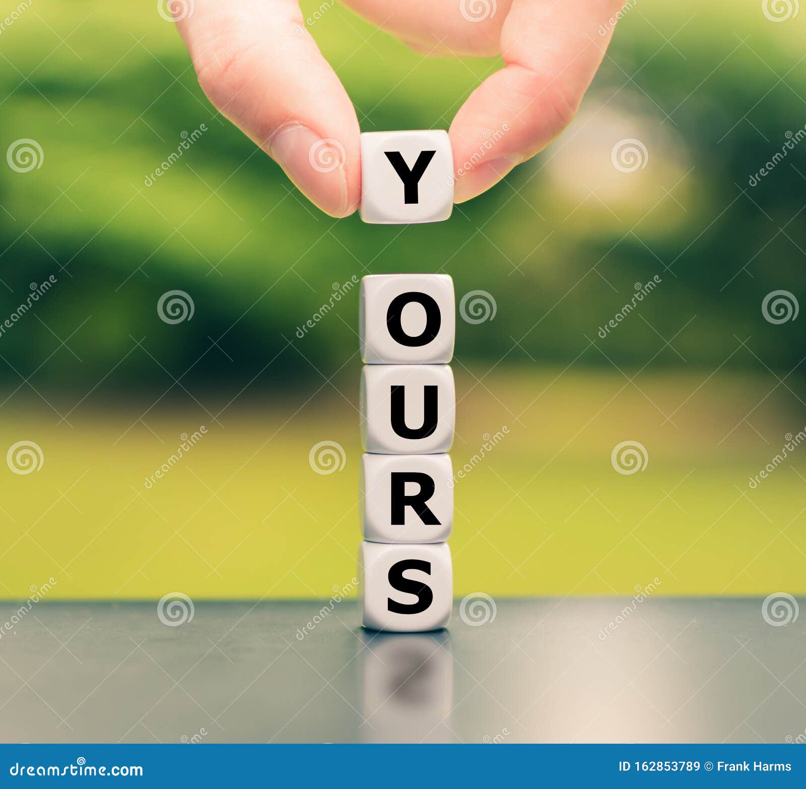Hand Places a Dice on a Stack and Changes the Word `ours` To `yours ...