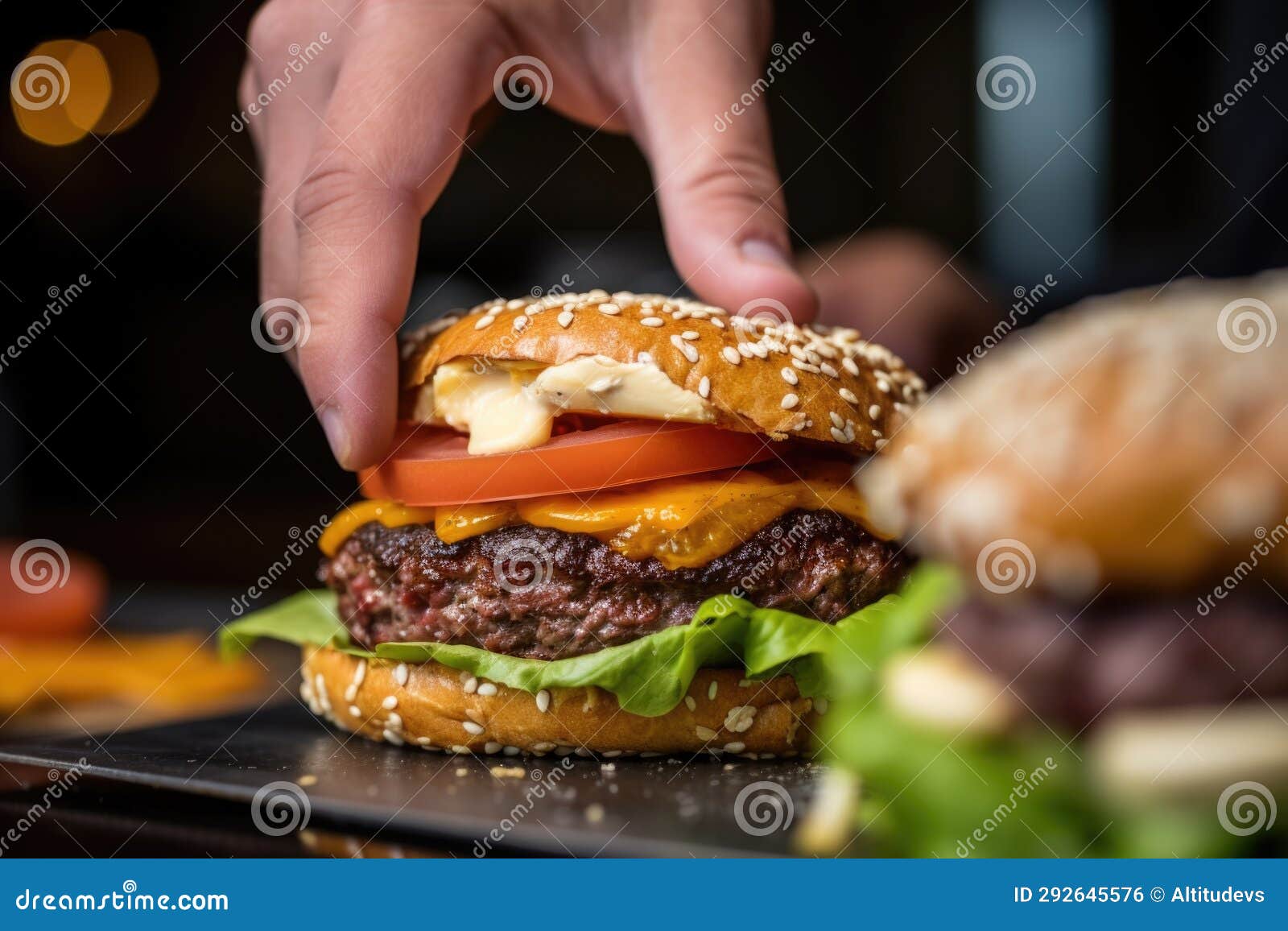 Hand Placing Cheese on a Sizzling Burger Patty Stock Photo - Image of ...