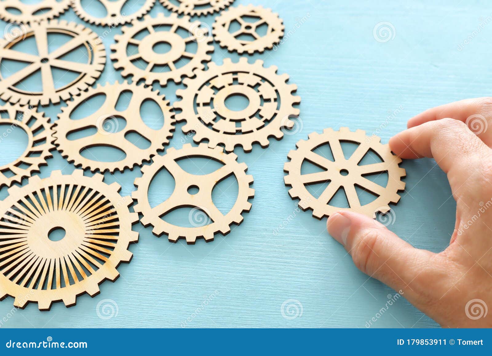 Hand Placing a Cogwheel in Set of Gears Mechanism Stock Image - Image ...
