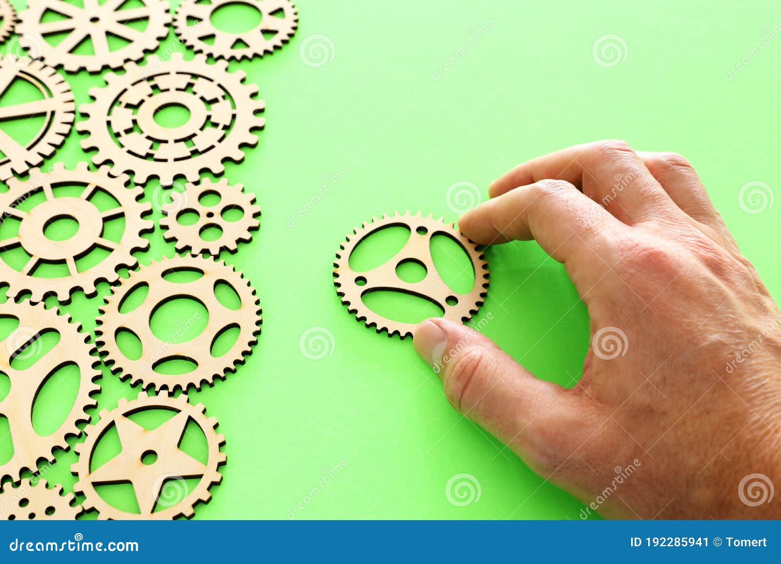 Hand Placing a Cogwheel in Set of Gears Mechanism Stock Image - Image ...