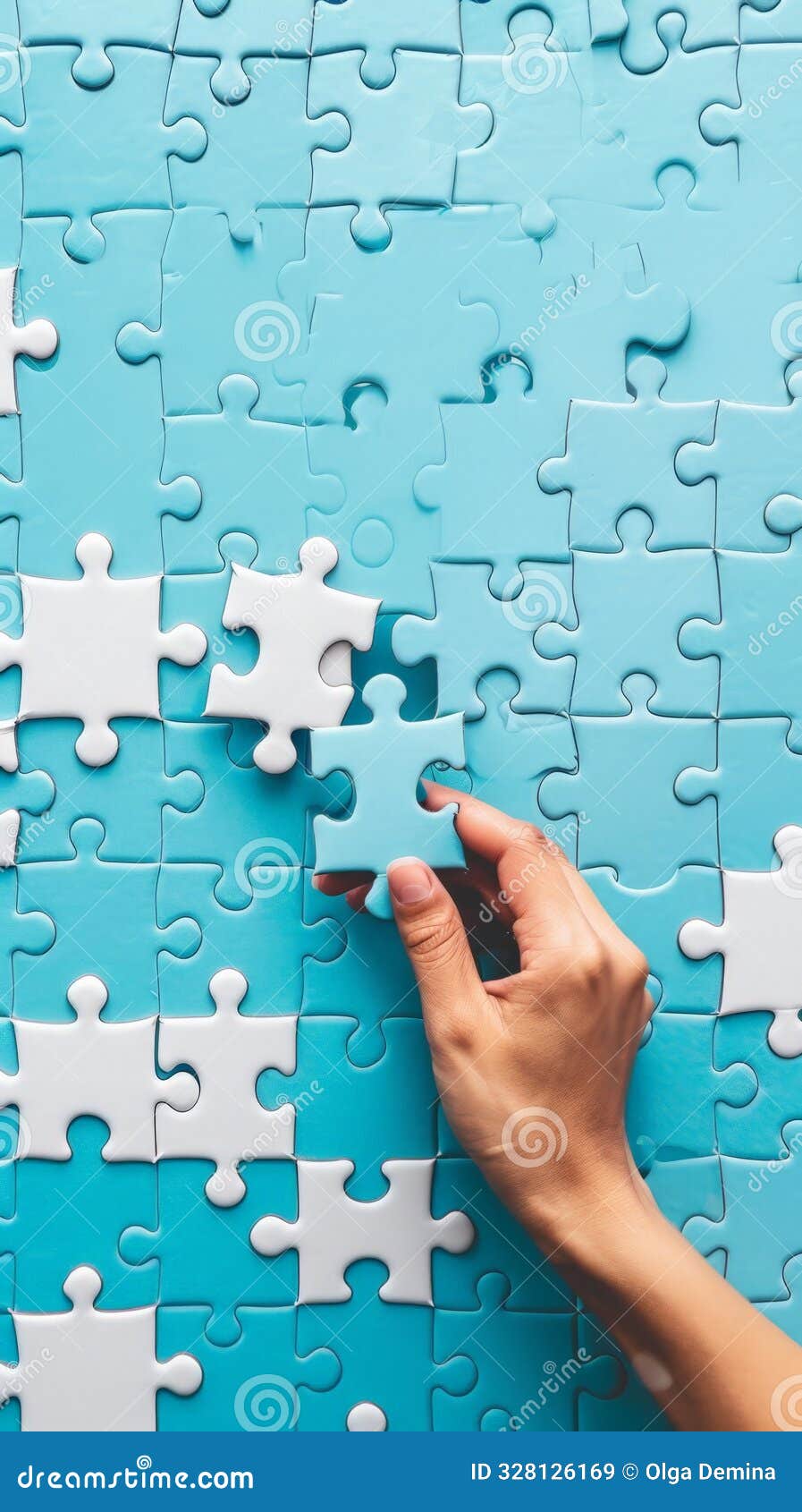 Hand Placing Final Piece into Blue Puzzle. Concept of Completion ...