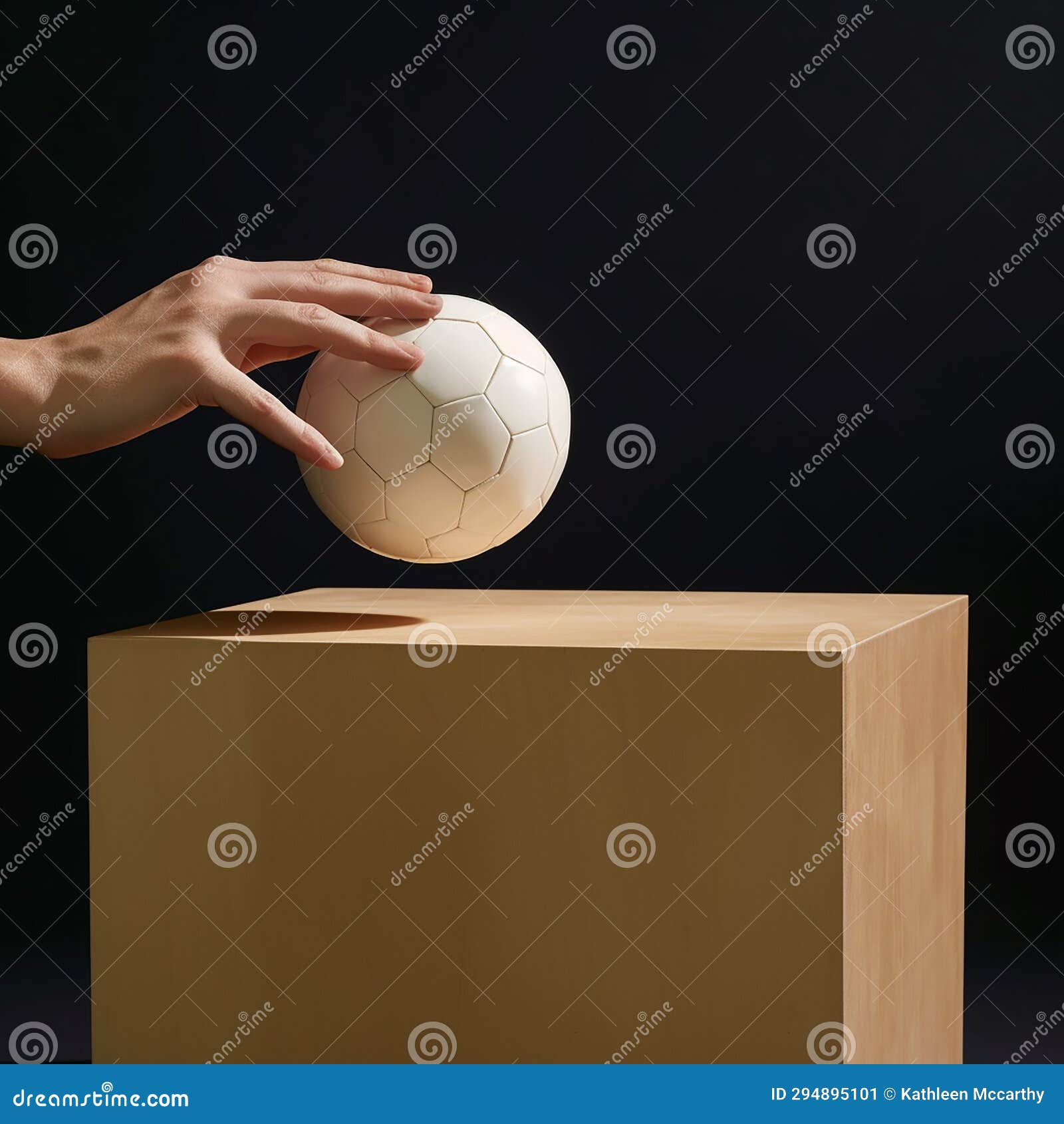 A Hand Placing a Soccer Ball on a Box Stock Image - Image of design ...