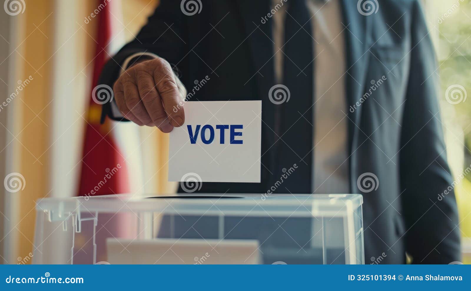 Hand Placing a Vote Card into a Transparent Ballot Box during an ...