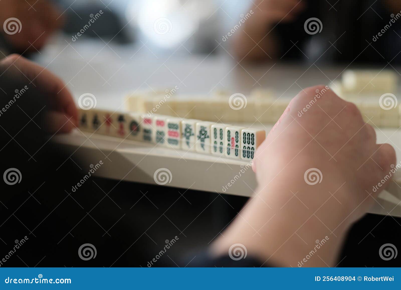 Hand Playing Chinese Mahjong Game Stock Photo - Image of mahjong, blur ...