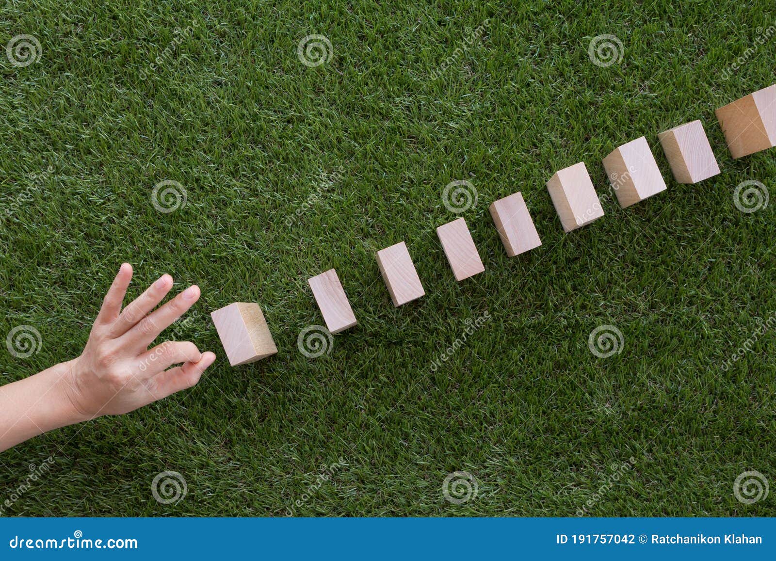 Hand playing domino effect stock photo. Image of interrupt - 191757042