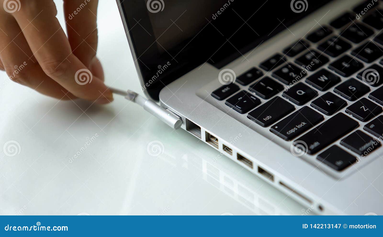 Hand Plugging Power Adapter in Laptop, Everyday Computer Technology ...