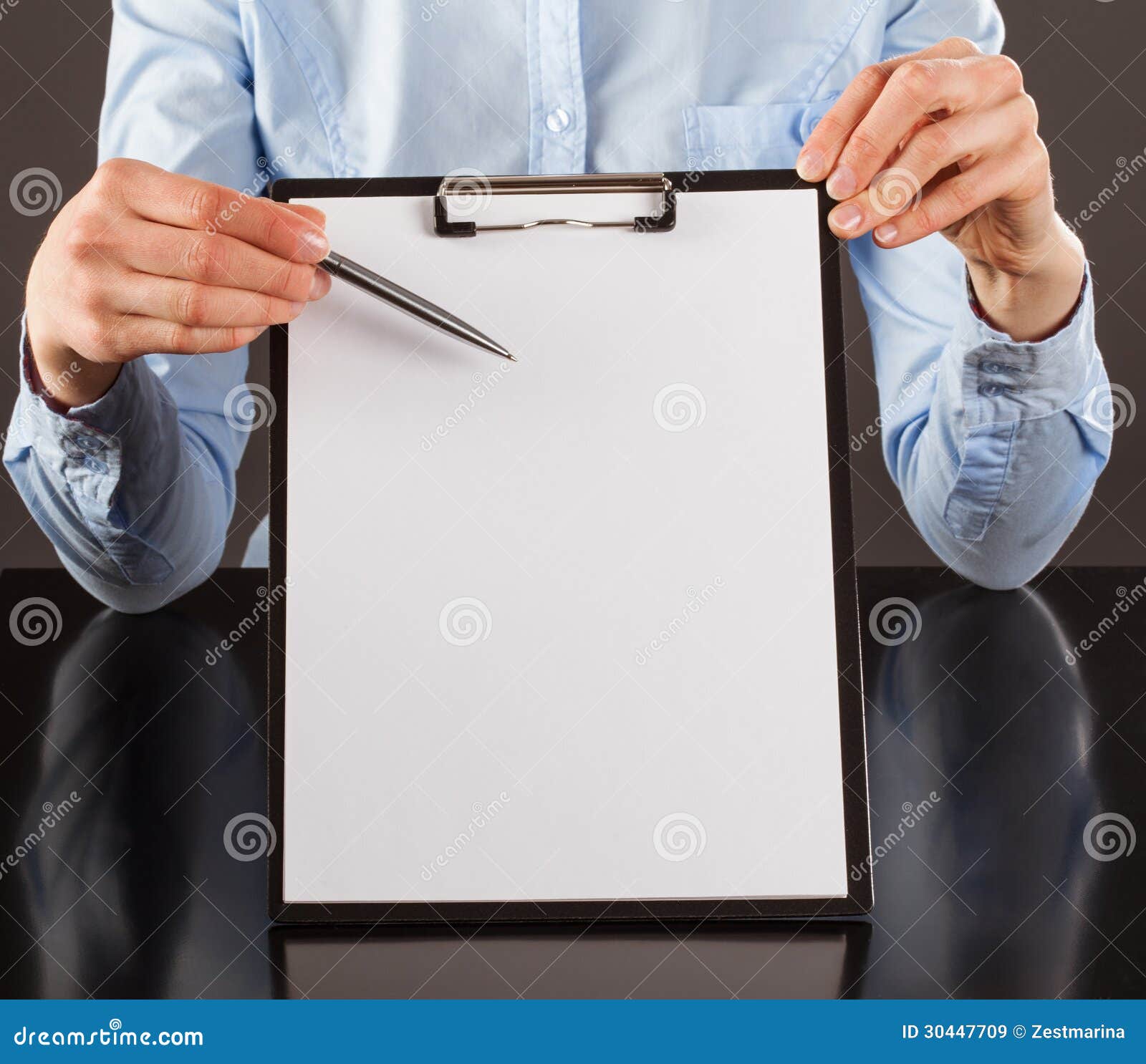 Hand Pointing at Blank Paper in Clipboard with a Pen Stock Image ...