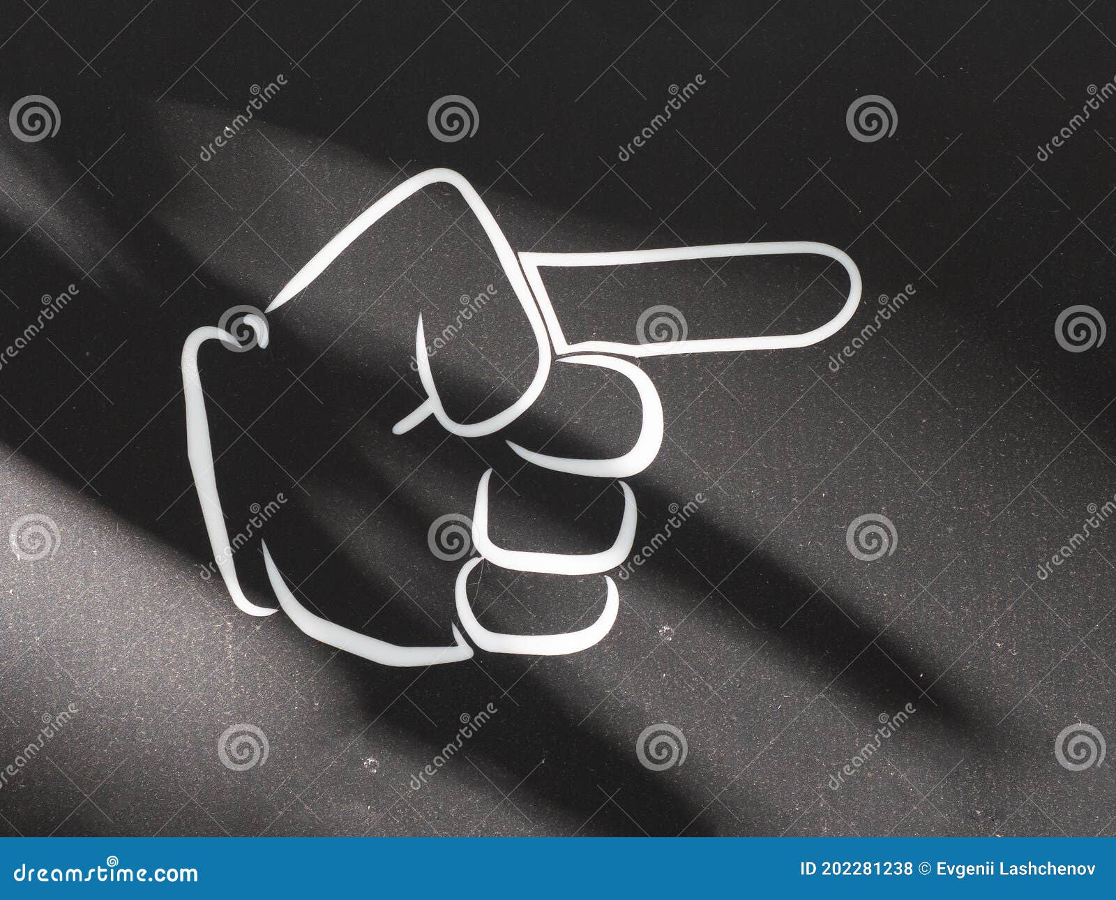 Hand Pointing with a Finger Drawn with a White Line on a Black Wall ...