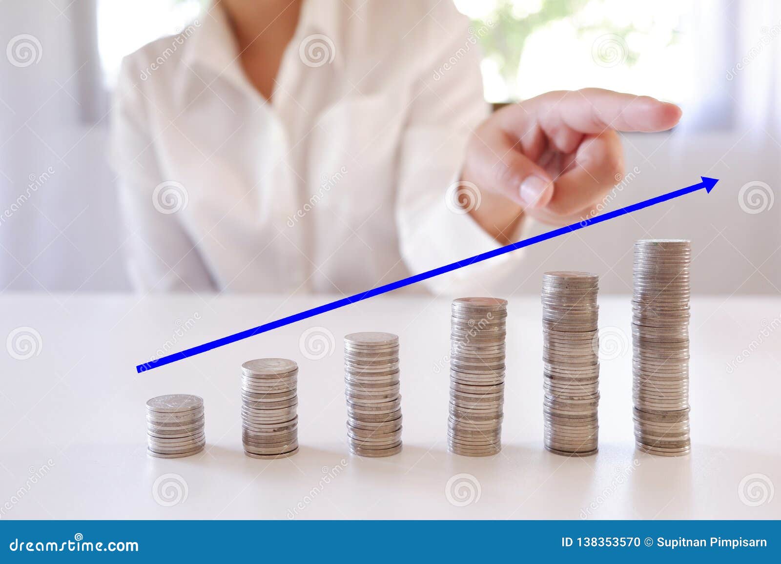 Hand Pointing Growing Money Stack of Coins Increasing Stock Photo ...