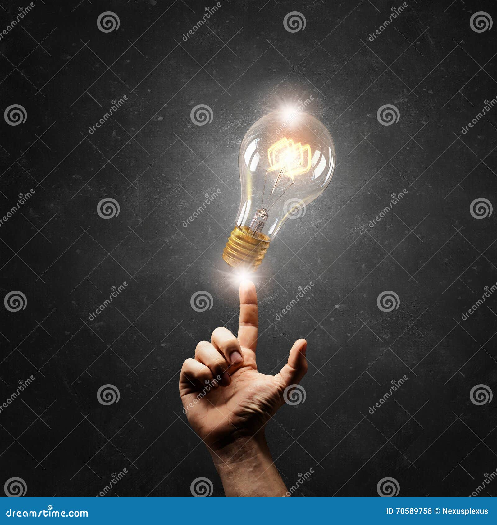 Hand pointing light bulb stock photo. Image of glass - 70589758