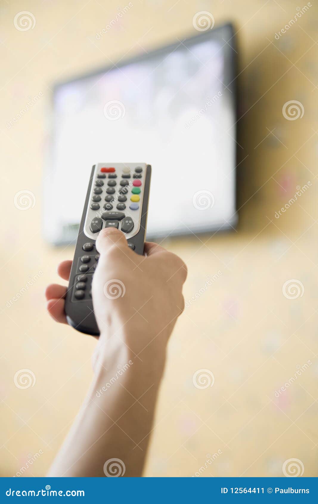 Hand Pointing Remote at TV stock image. Image of choice - 12564411
