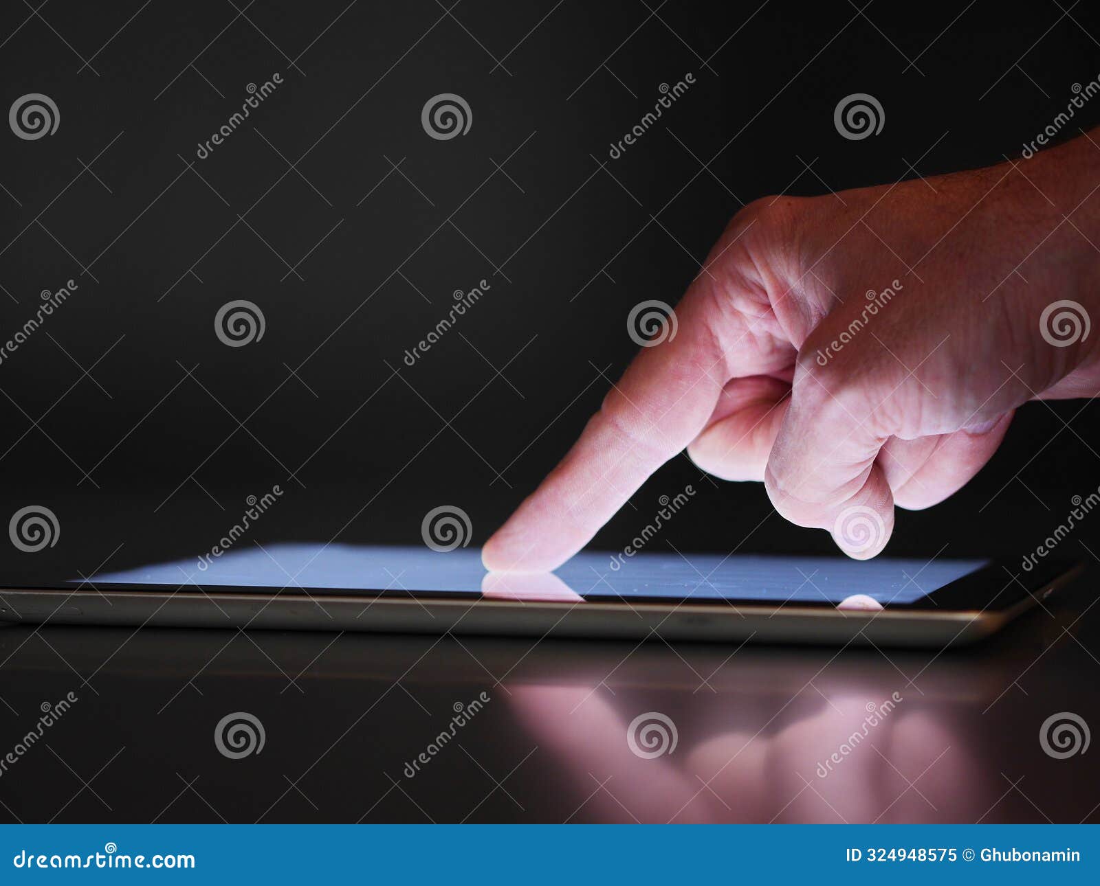 A Hand Pointing at a Tablet Screen. Stockphoto. Stock Image - Image of ...