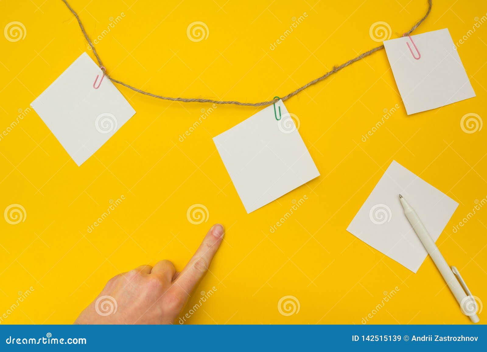 Hand Pointing To the Note Papers Hanging on a Rope, Empty Space for ...