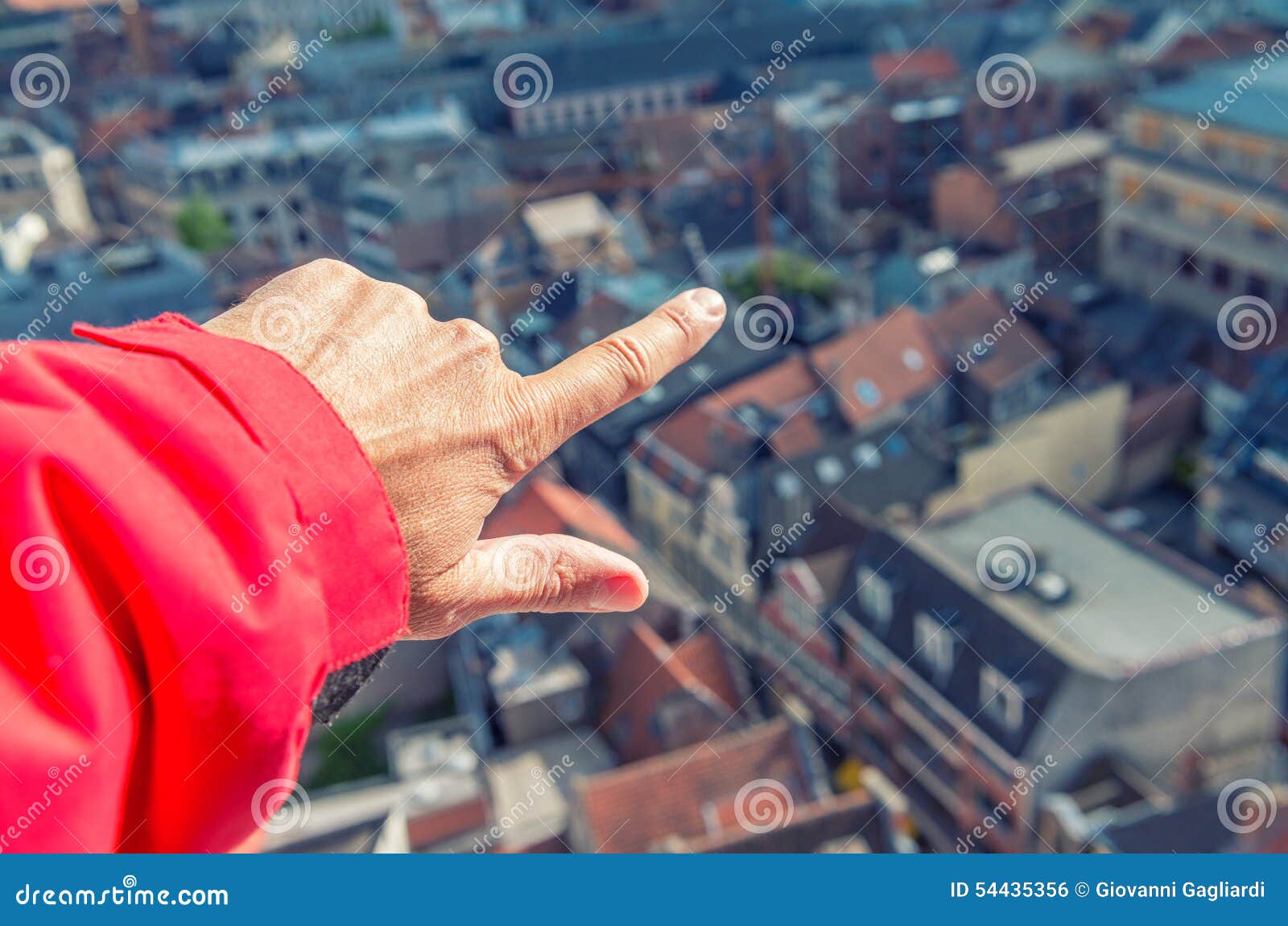 Hand Pointing Towards City Buildings Stock Photo - Image of finger ...